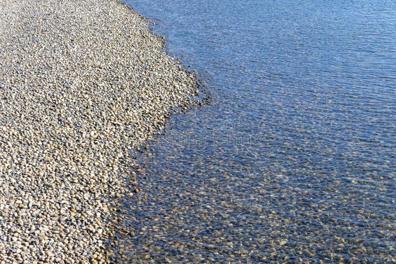 Rocks Under the Shallow Water on a Beach Stock Photo - Image of ...