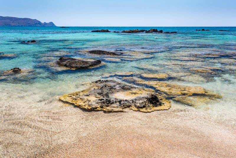 Rocks in the Water on the Beach of Elafonissi. Crete. Greece Stock ...