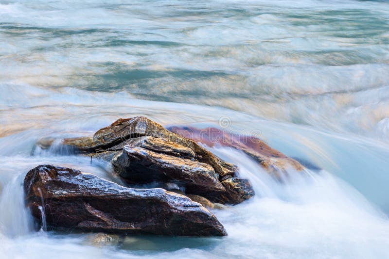 Rocks in water stock photo. Image of turquoise, people - 77974342