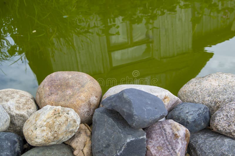 Rocks by the water stock photo. Image of horizon, simplicity - 196940210