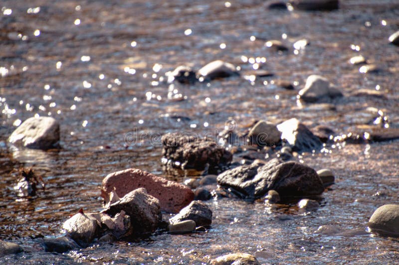 Rocks in the Water with Sunlight on Them from Below the Surface Stock ...