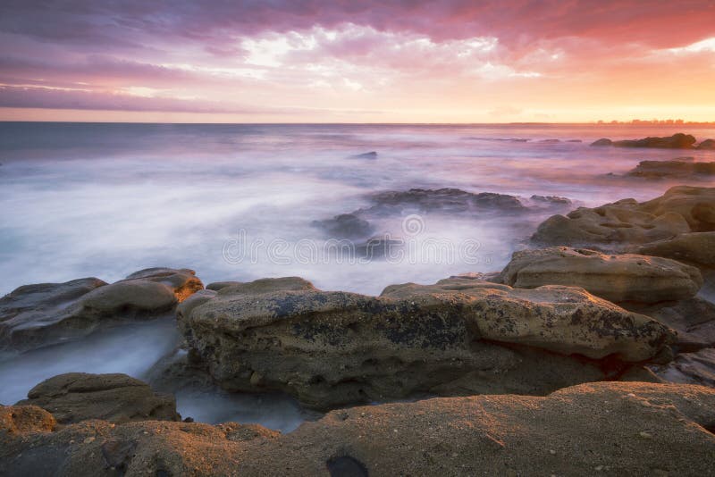 Rocks and Waves at Kings Beach, QLD. Stock Photo - Image of sand, beach ...
