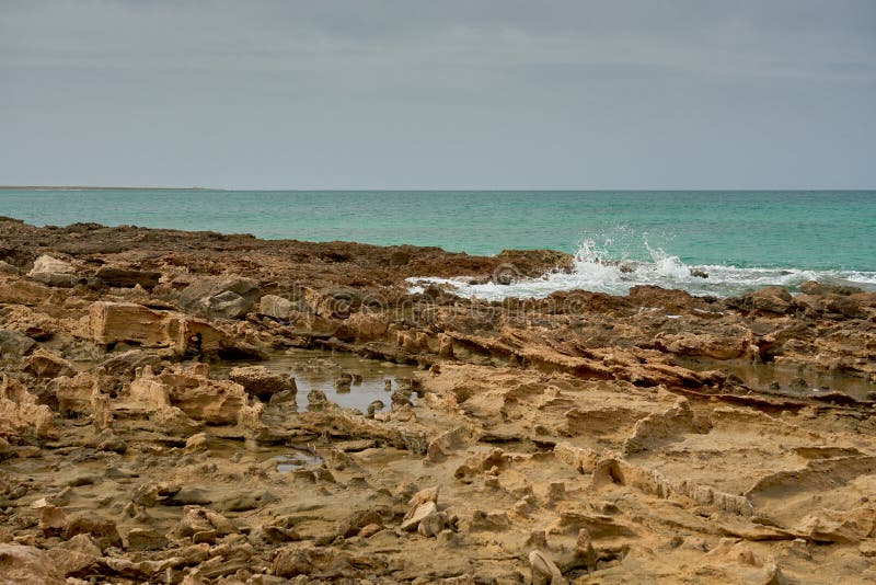 Rocks and Waves on a Sandy Tropical Beach. Stock Photo - Image of ocean ...
