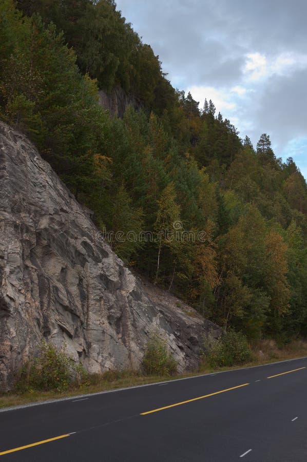 Rocks and woods near road. stock photo. Image of highway - 30730558