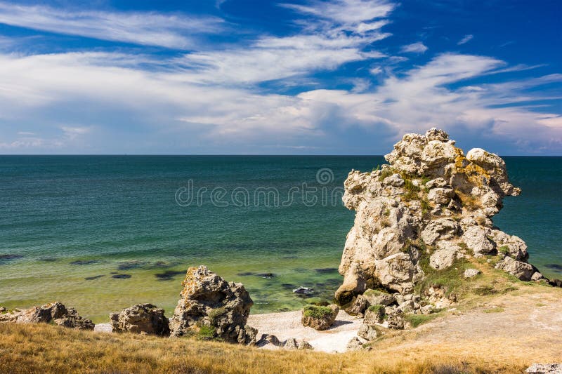 Rocks Yellow and Stones of Unusual Bizarre Shape on the Sandy Seashore ...