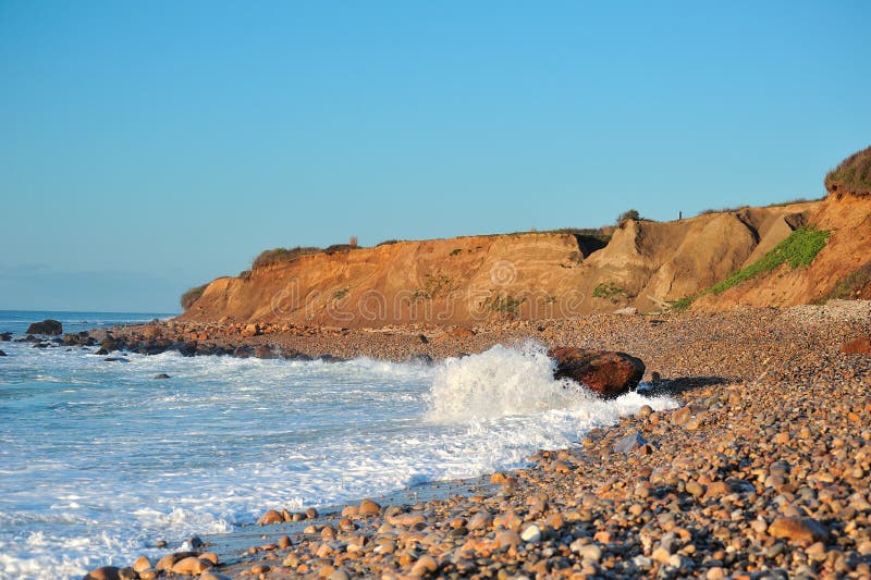 Rocky beach stock photo. Image of water, cliff, sunrise - 19713062