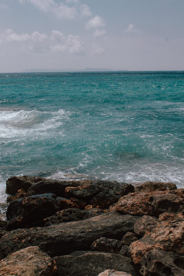 Rocky Beach in Mallorca, in Summer at High Tide with the Waves Hitting ...