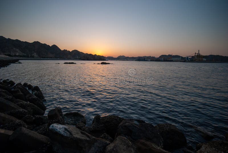 Rocky beach Muscat stock photo. Image of coast, horizon - 184165798