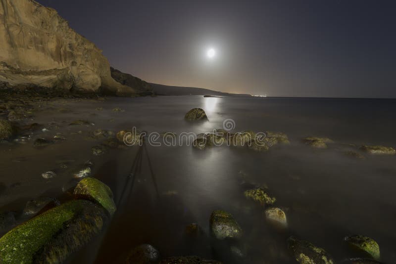 Rocky beach at night stock image. Image of calm, beach - 62751805