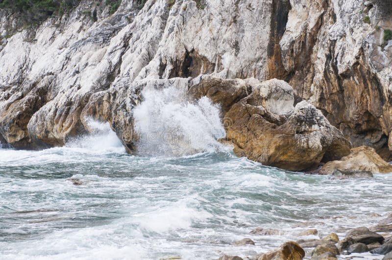 Rocky beach stock photo. Image of waves, rocks, beach - 56099014