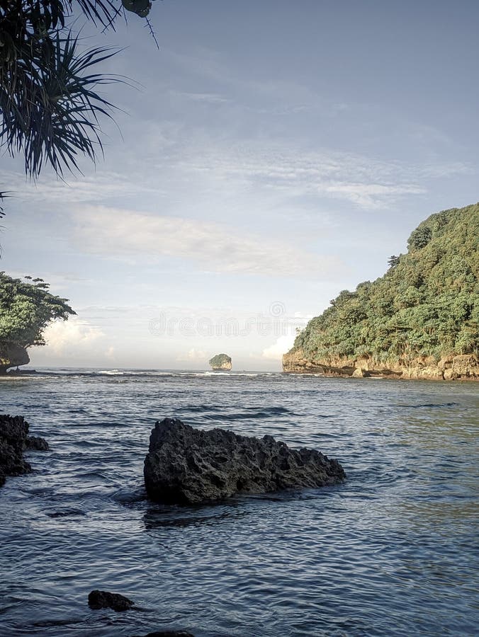 A Rocky Beach with Soft Sand Stock Photo - Image of secluded, beach ...