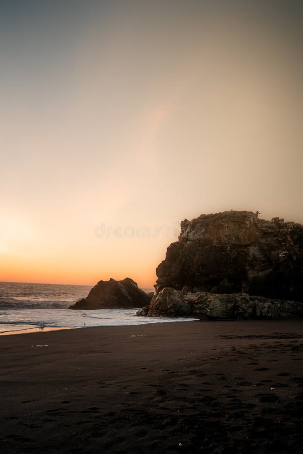 Rocky Beach at Sunset with Colorful Sky Stock Photo - Image of scenic ...
