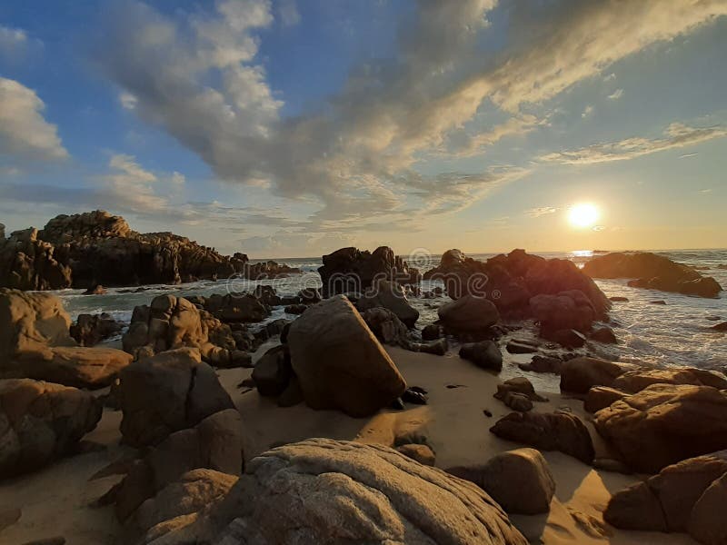 Rocky Beach Sunset Under Clouds Stock Image - Image of beach, clouds ...