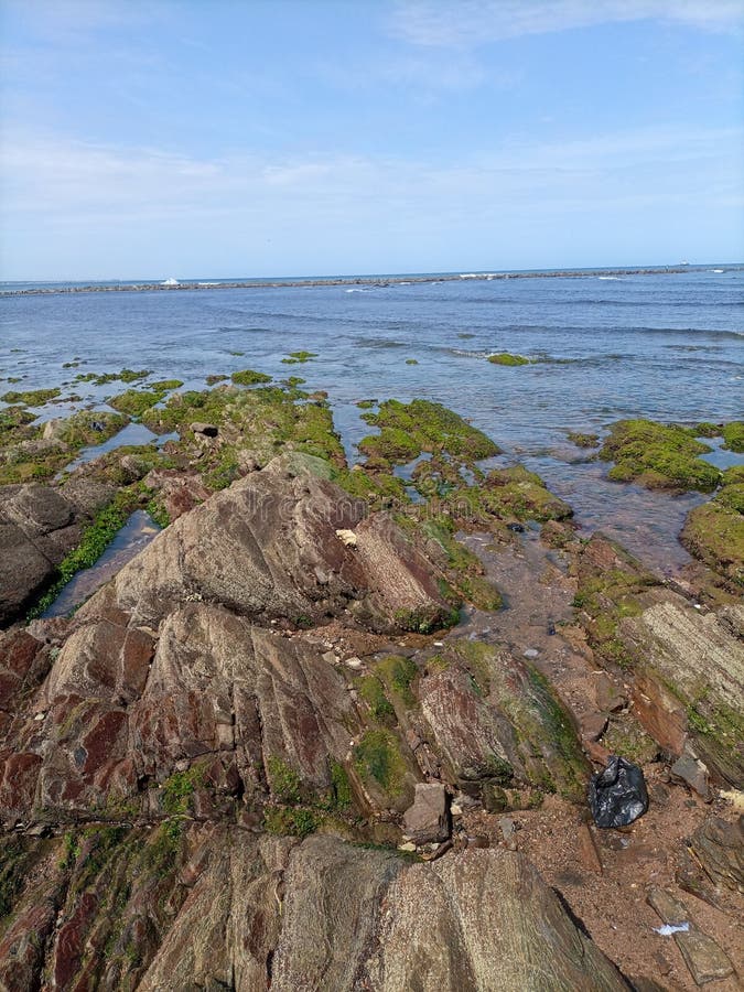 Rocky beach at Tema stock image. Image of ocean, rocky - 225975829