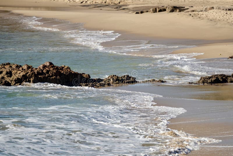 Rocky beach with waves stock image. Image of sand, sandy - 141203297