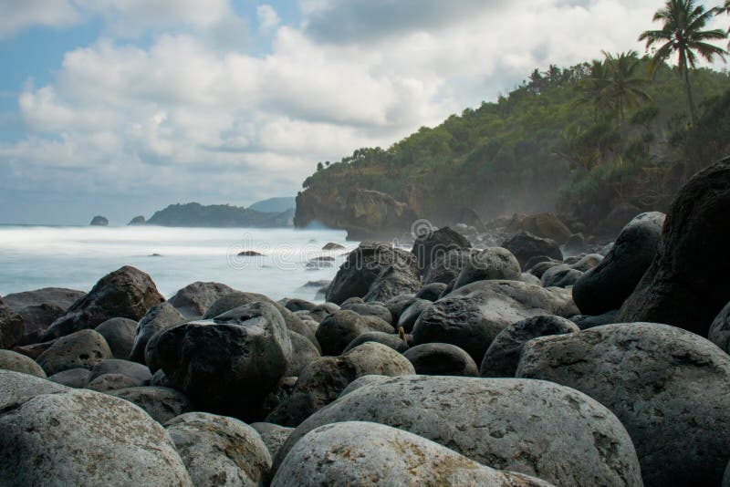 Rocky Beach Withwaves As Smooth As Snow Stock Photo - Image of pacitan ...