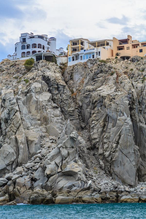 A Rocky Cliff with a House on Top of it Stock Photo - Image of scenic ...