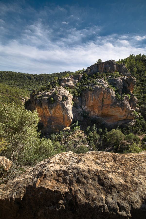 Landscape of Rocky Cliffside Path Overlooking Lush Green Valley with ...