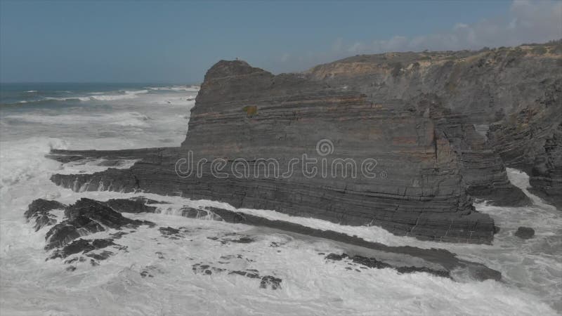 Rocky Cliff Near the Ocean during Sunset Stock Video - Video of ...
