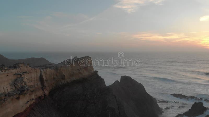Rocky Cliff Near the Ocean during Sunset Stock Video - Video of nature ...