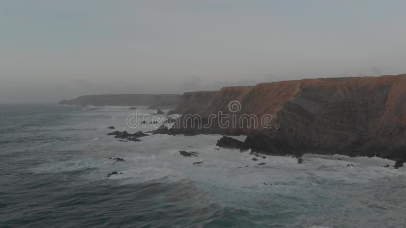 Rocky Cliff Near the Ocean during Sunset Stock Footage - Video of ...
