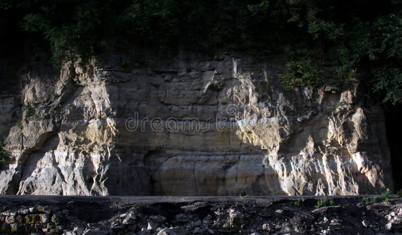 Rocky Cliff by the Road Surrounded by Green Trees Stock Image - Image ...