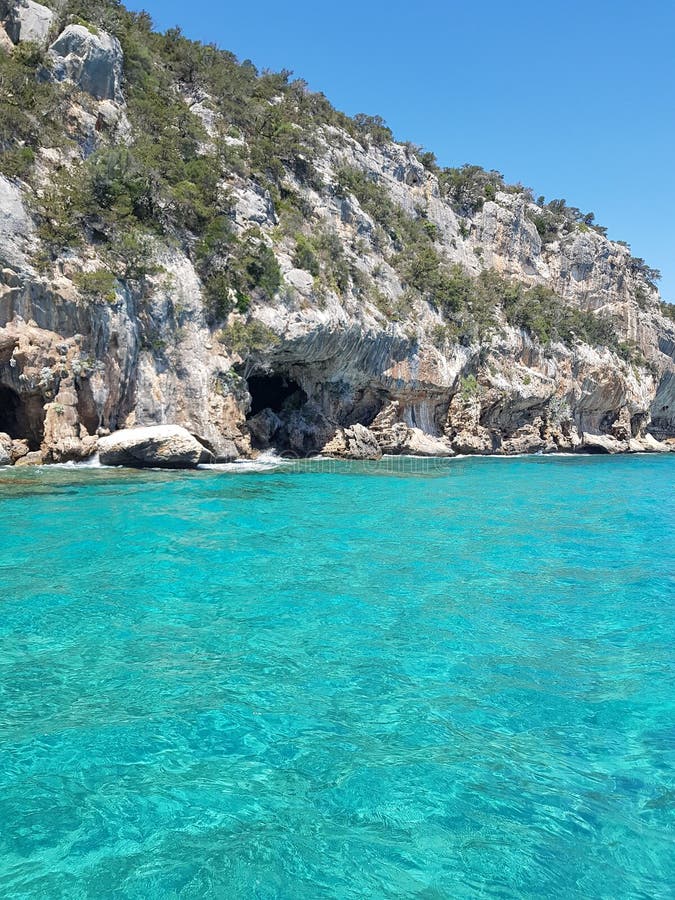 Rocky Cliffs and Clear Water on Sardinian Coast Stock Image - Image of ...