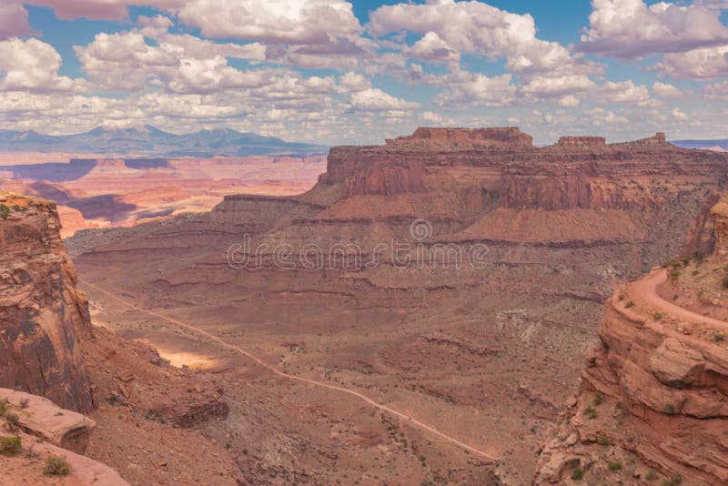Rocky Cliffs in a Desert Under a Cloudy Sky Stock Photo - Image of arid ...