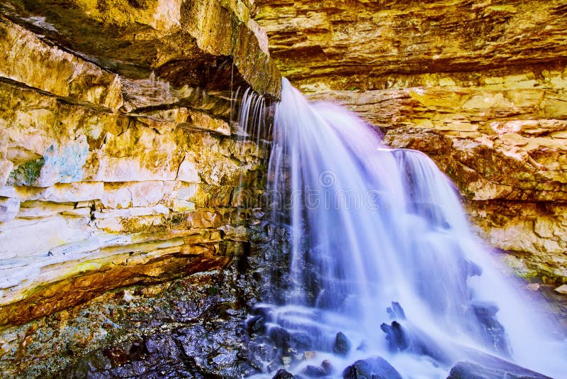 Rocky Cliffs with Waterfall Creating Gorge Stock Photo - Image of ...