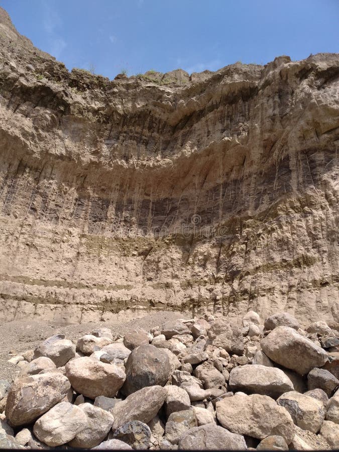 Rocky Cliffside View from Below Stock Image - Image of rocky, high ...