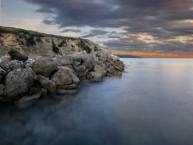 Rocky Coast Against the Sunset Stock Photo - Image of coast, sunset ...