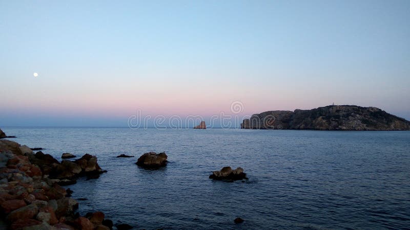 Rocky Coast with Island at Night Stock Photo - Image of coast, rocky ...