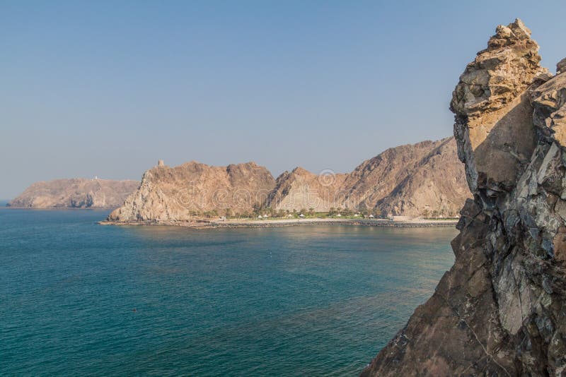Rocky coast in Muscat, Om stock image. Image of tower - 187511219