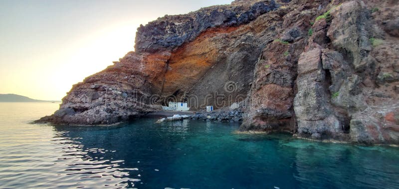 Coastal Cliff with Small Structures in Santorini at Dusk Stock Photo ...