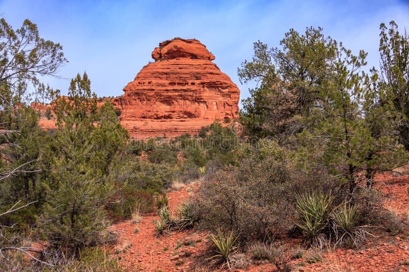A Rocky Hillside with a Large Red Rock in the Middle Stock Image ...