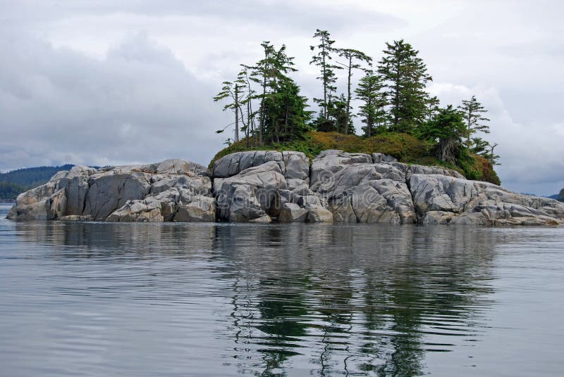 Rocky islet stock photo. Image of cloud, shore, boulder - 32861584