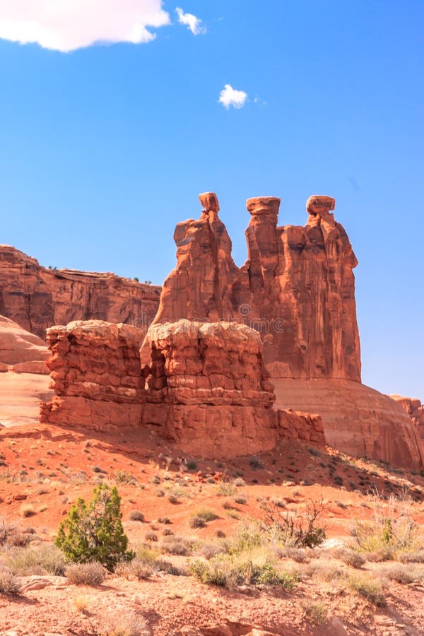 A Rocky Mountain Range with Three Large Rock Formations Stock Photo ...