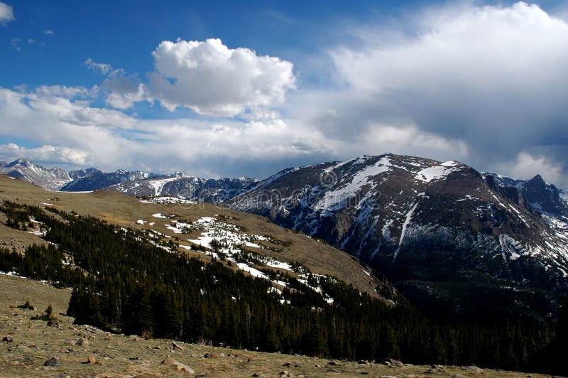Rocky mountain snow clouds stock photo. Image of landscape - 23352164
