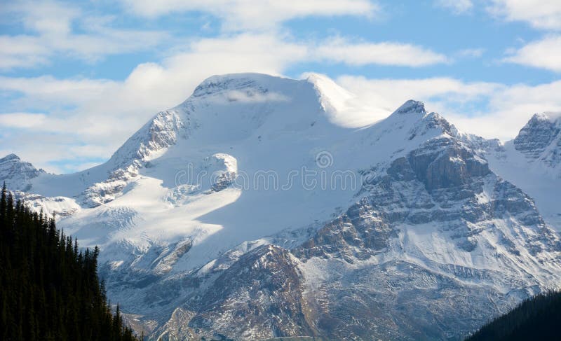 Rocky mountains in Snow stock photo. Image of cloud - 162371900