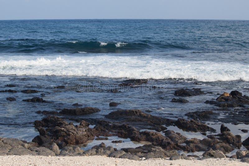 Rocky ocean beach stock photo. Image of water, hawaii - 77579950