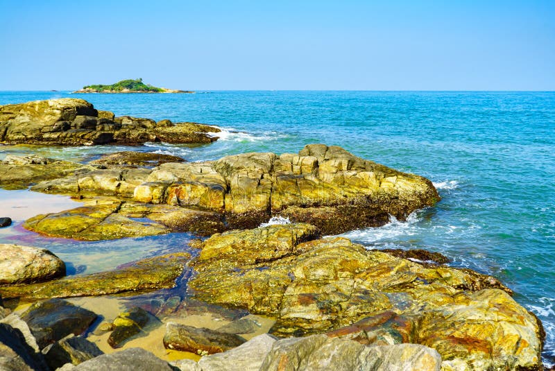 Rocky Ocean Shore and Blue Sky at Sunrise Stock Image - Image of beach ...
