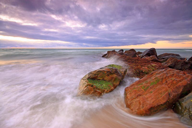 Rocky outcrop stock image. Image of water, overcast, clouds - 13901959