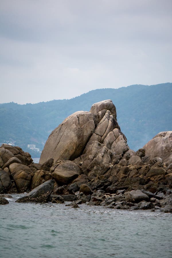Rocky Outcrop Surrounded by Crystal-clear Waters. Stock Photo - Image ...
