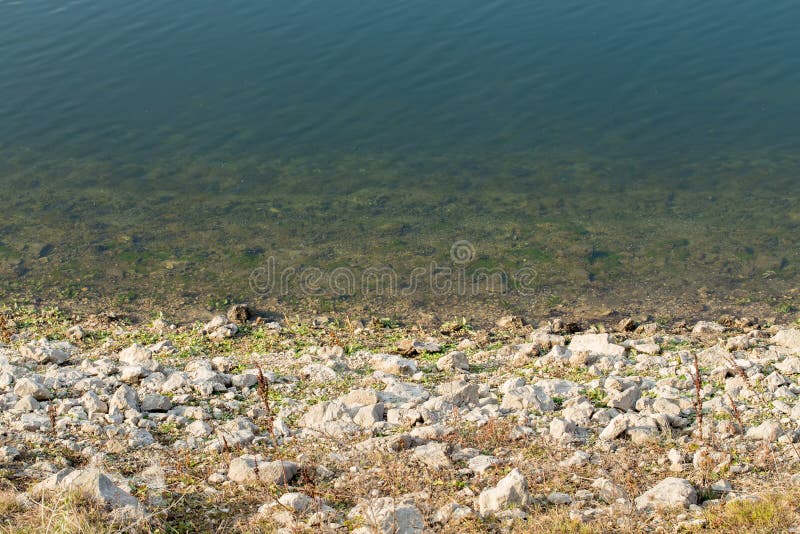 Rocky river bank stock image. Image of reflect, river - 63836737
