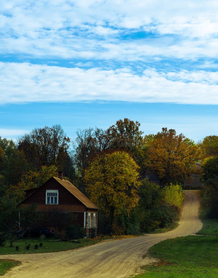 A Rocky Road Up the Hill. the House at the Side of the Road Stock Photo ...