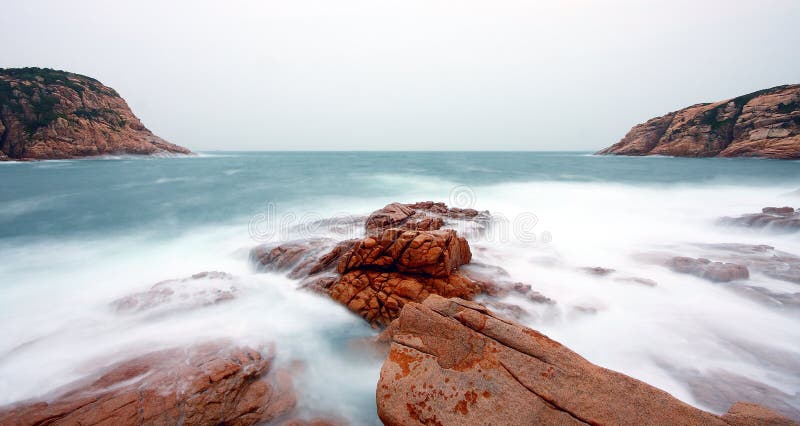 Rocky Sea Coast and Blurred Water in Shek O Stock Photo - Image of ...