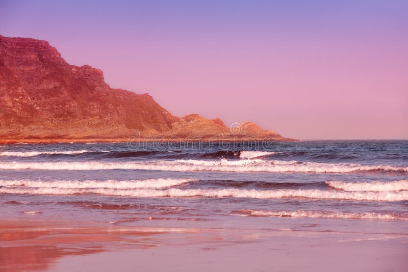 Rocky Sea Shore at Sunset. Sandy Beach Stock Photo - Image of purple ...