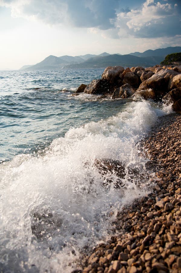 Rocky Sea Shore and Waves Splashing Stock Photo - Image of seascape ...