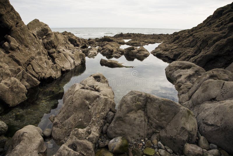 Rocky seashore stock photo. Image of wales, horizon, rockpool - 30849628