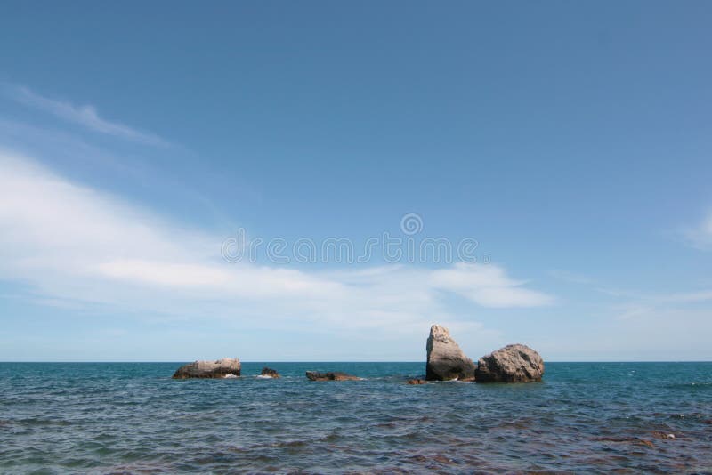 A Rocky Seashore with Large Stones in the Water Stock Image - Image of ...